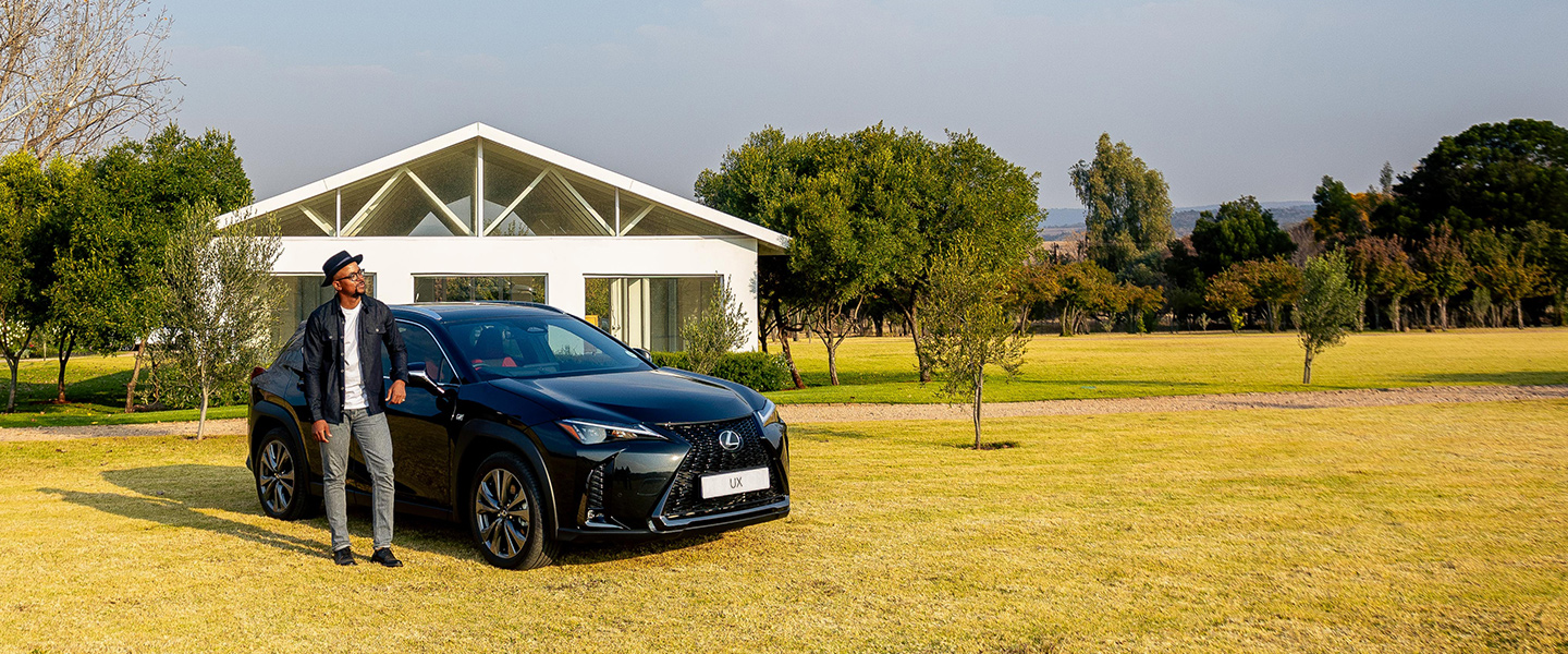 Maps Maponyane in front of the Lexus UX F Sport